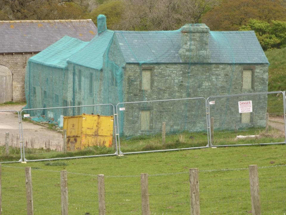 Police launch investigation into farmhouse covered in plastic netting ...